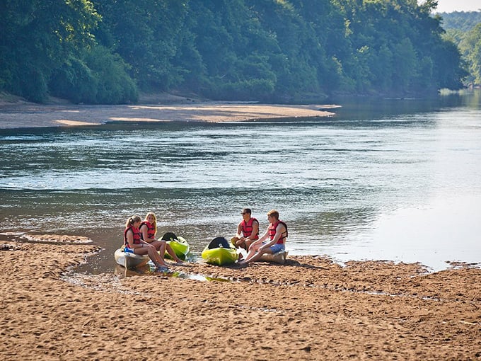 Nothing says "Georgia summer" quite like friends gathered at the river's edge, plotting their kayaking adventure while the water whispers, "Come on in."