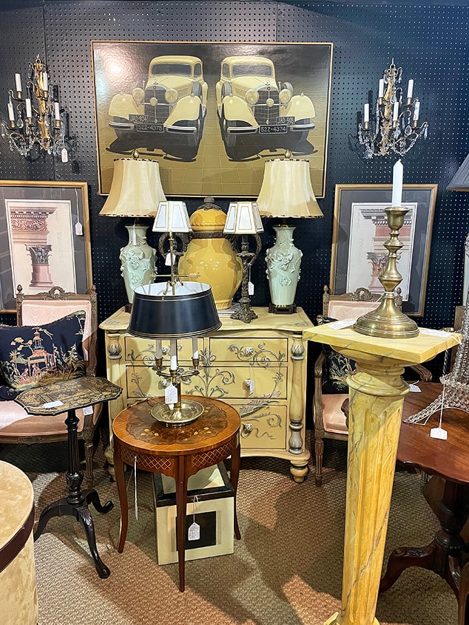 This display isn't just selling lamps—it's offering the chance to own a piece of automotive history with that stunning vintage car artwork. 