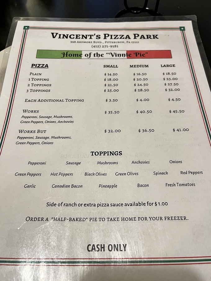 The menu tells you everything you need to know: cash only, half-baked options for home, and the legendary "Vinnie Pie" awaits. 