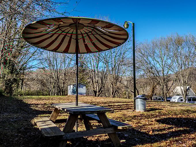 This striped umbrella picnic spot isn't trying too hard – it's just waiting for you to slow down, sit a spell, and remember what matters.