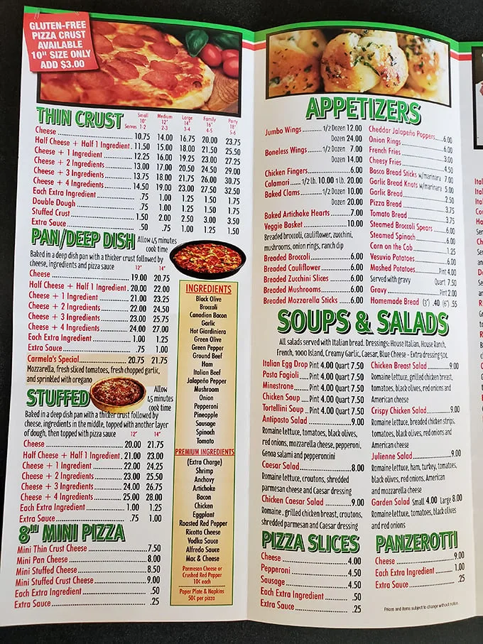 The menu tells the delicious story—pan pizza, stuffed pizza, and Carmela's Special waiting to change your life.