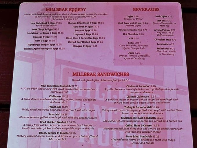 The menu reads like a love letter to breakfast classics – a roadmap to happiness printed on pink paper.