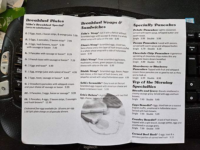 A menu that reads like comfort food poetry – breakfast specials, wraps, and pancakes that could make even IHOP jealous.
