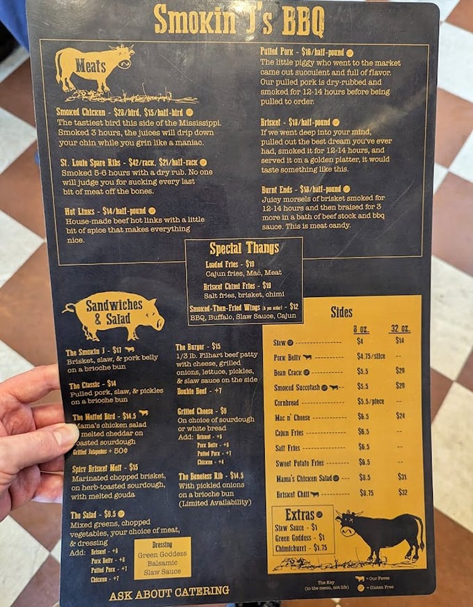 A menu that reads like barbecue poetry. Each description promises smoky delights that'll have you planning your next visit before finishing your first bite.