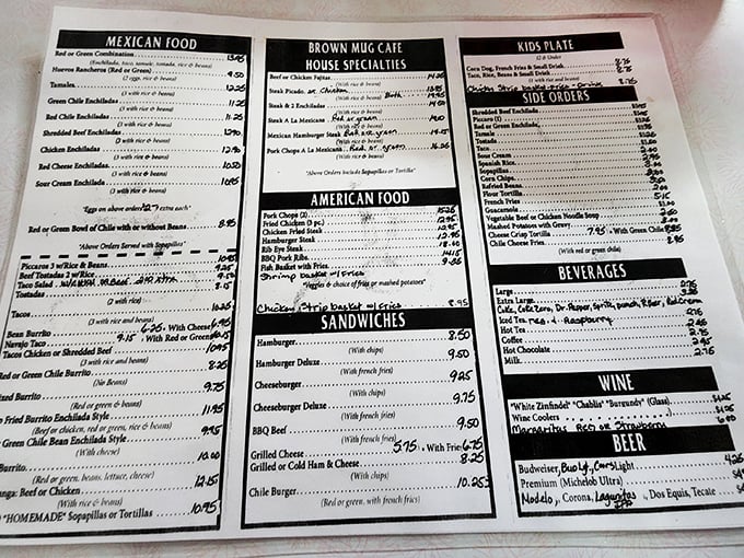 The menu reads like a love letter to Southwestern cuisine—green chile enchiladas, menudo, and chimichangas sharing space with classic American comfort food.
