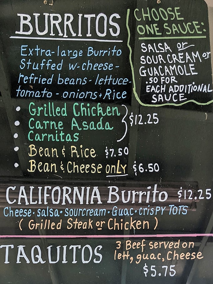 The handwritten menu board tells you everything you need to know—this place prioritizes flavor over fancy, with burritos that demand your immediate attention.