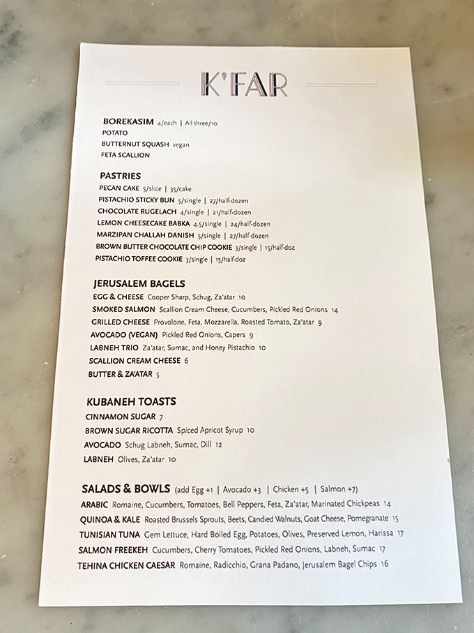 The menu reads like a delicious travelogue through Israeli cuisine, with Jerusalem bagels stealing the spotlight alongside kubaneh toasts and borekasim that will make your taste buds dance.