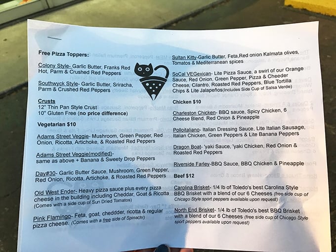 Pizza Cat's menu reads like a fever dream of a hungry genius—from Hot Cheetos toppings to brisket pizzas that make traditionalists question everything.