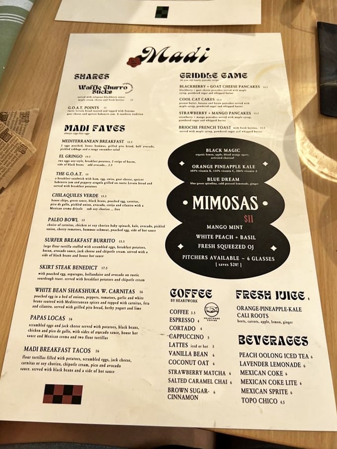 The menu reads like a love letter to breakfast, where Mediterranean meets Mexican meets "why haven't I tried goat cheese pancakes before?"