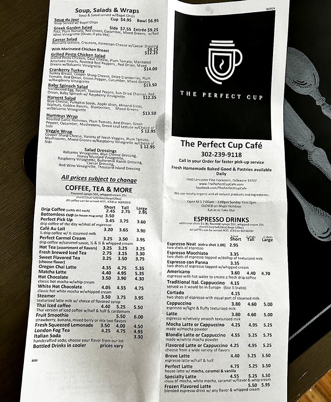 The menu reveals a treasure map of culinary possibilities—from hearty breakfast classics to fresh salads that won't leave you feeling like you need a nap.