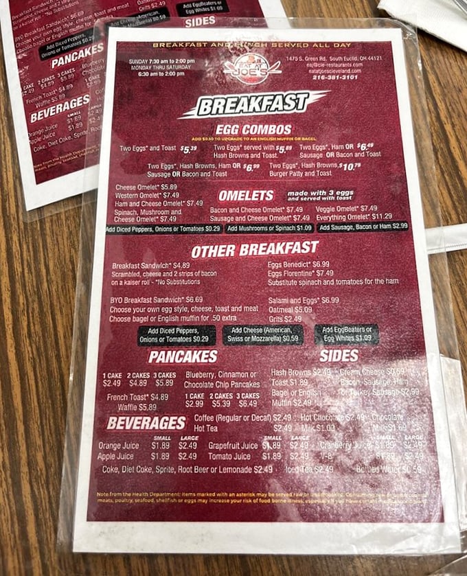 This burgundy menu holds the roadmap to breakfast bliss, featuring legendary eggs benedict and more.