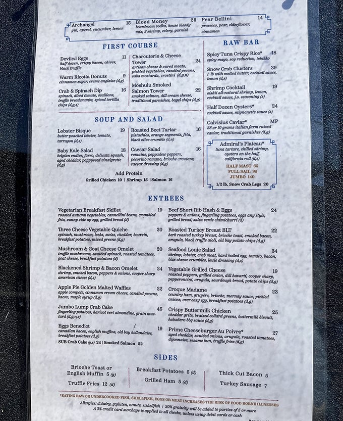 The menu reads like maritime poetry—"Lobster Bisque" and "Admiral's Plateau" promising voyages of flavor without requiring sea legs.