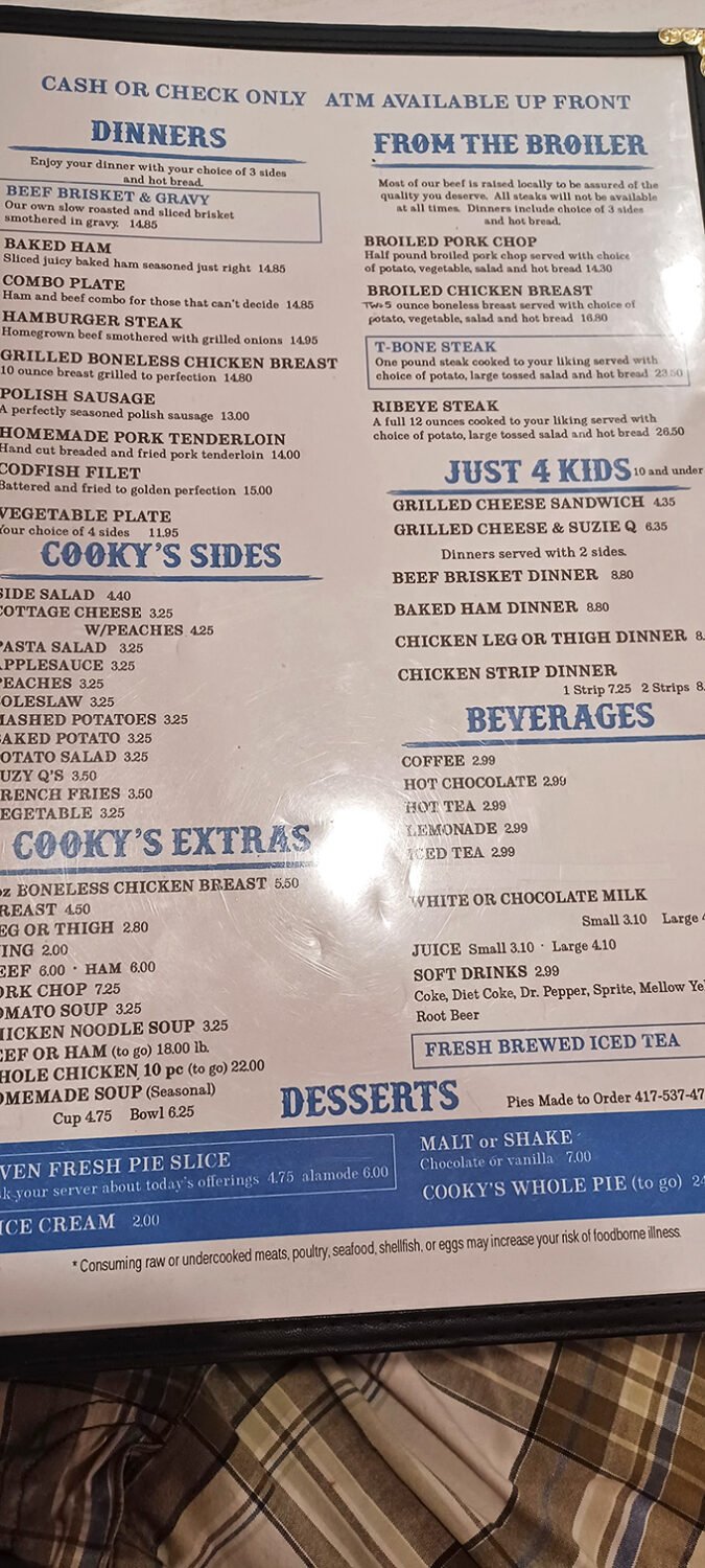 The menu reads like a love letter to Midwest comfort food—beef brisket, Polish sausage, and homemade pork tenderloin that would make your grandmother jealous.