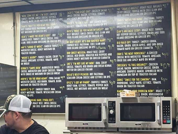The menu board at Diamond Deli reads like a novel of sandwich possibilities, each quirky name promising its own delicious story waiting to be devoured.