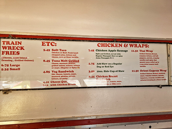 Menu board poetry: "Train Wreck Fries" isn't a culinary disaster—it's a masterpiece of cheese, chili, and grilled onions that'll derail your diet in the most delicious way.