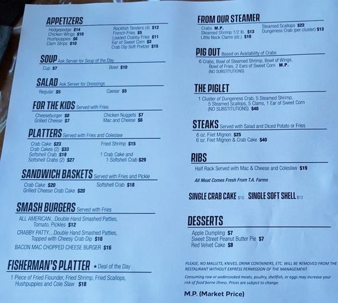 A menu that reads like a love letter to the Chesapeake Bay. The "Pig Out" platter isn't just a meal—it's a commitment.