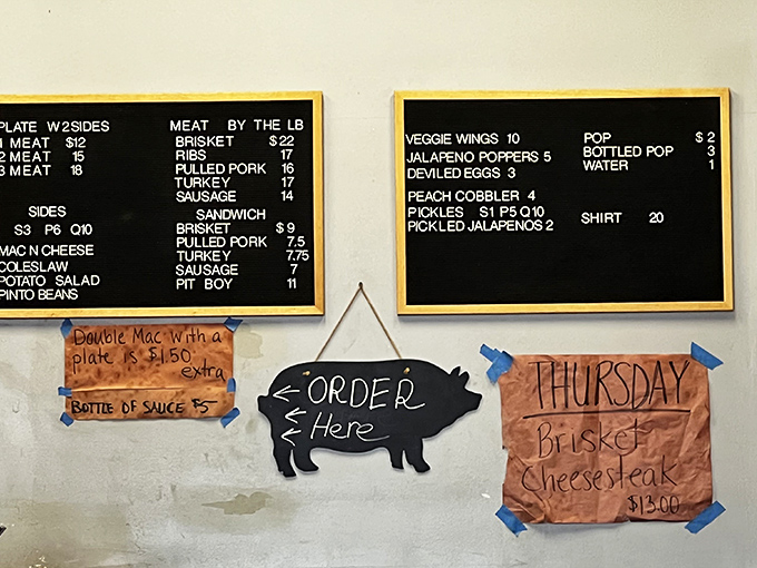 A menu board that tells you everything you need to know—meat is the star, sides are the supporting cast.