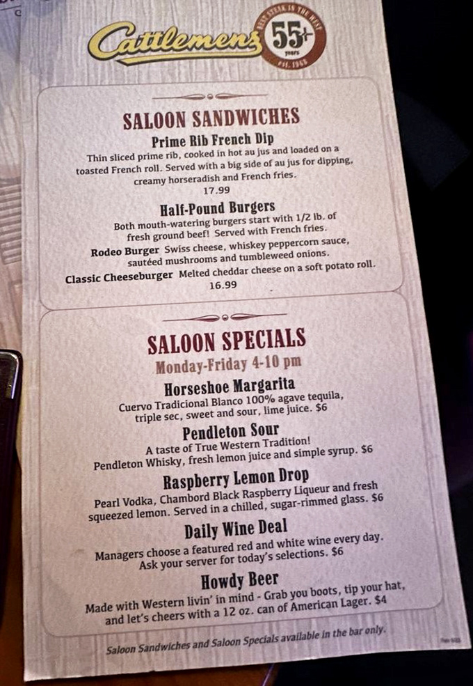 The menu doesn't mince words—it minces nothing. Half-pound burgers, Prime Rib French Dip, and cocktails with names like "Howdy Beer" tell you exactly where you stand.