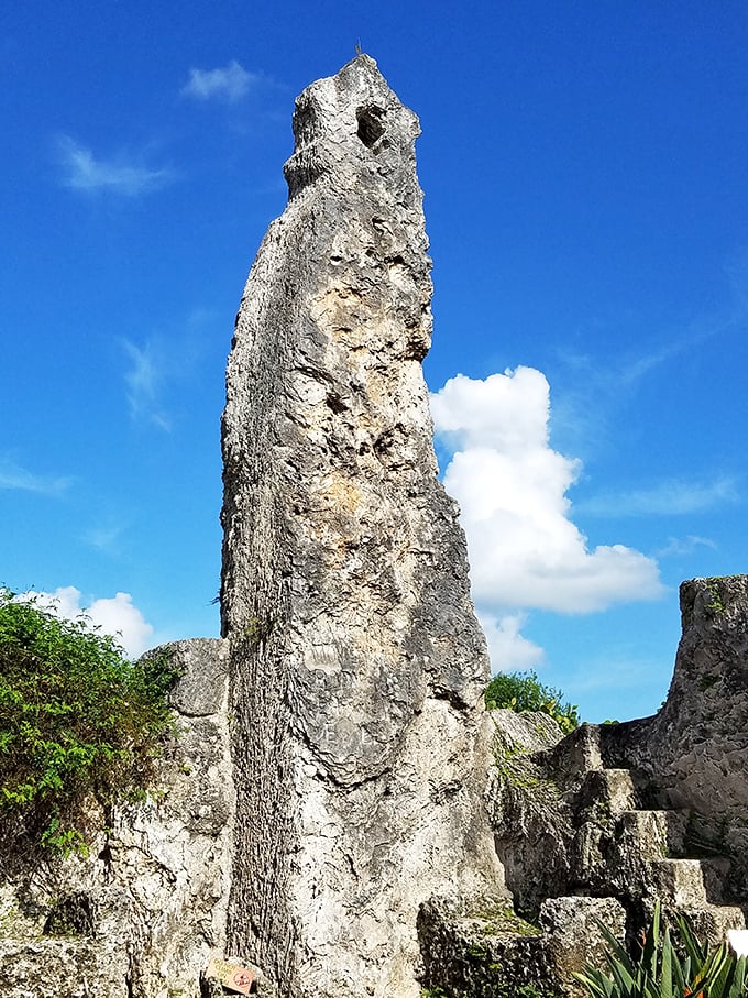 This towering monolith reaches skyward like nature's exclamation point, a 30-ton testament to one man's mysterious capabilities.