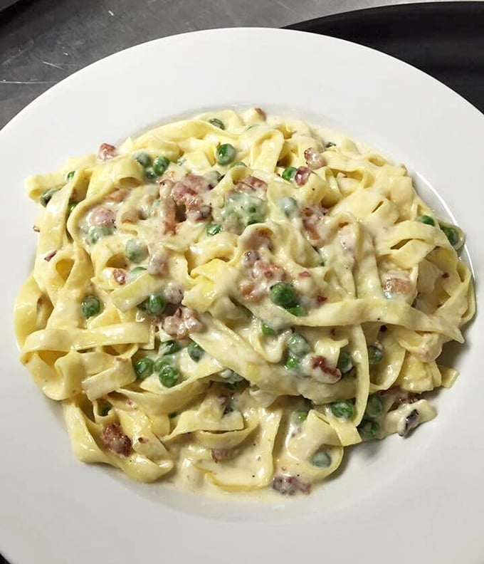 Fettuccine carbonara that would make an Italian grandmother weep with joy. Creamy, dreamy pasta perfection on a plate.