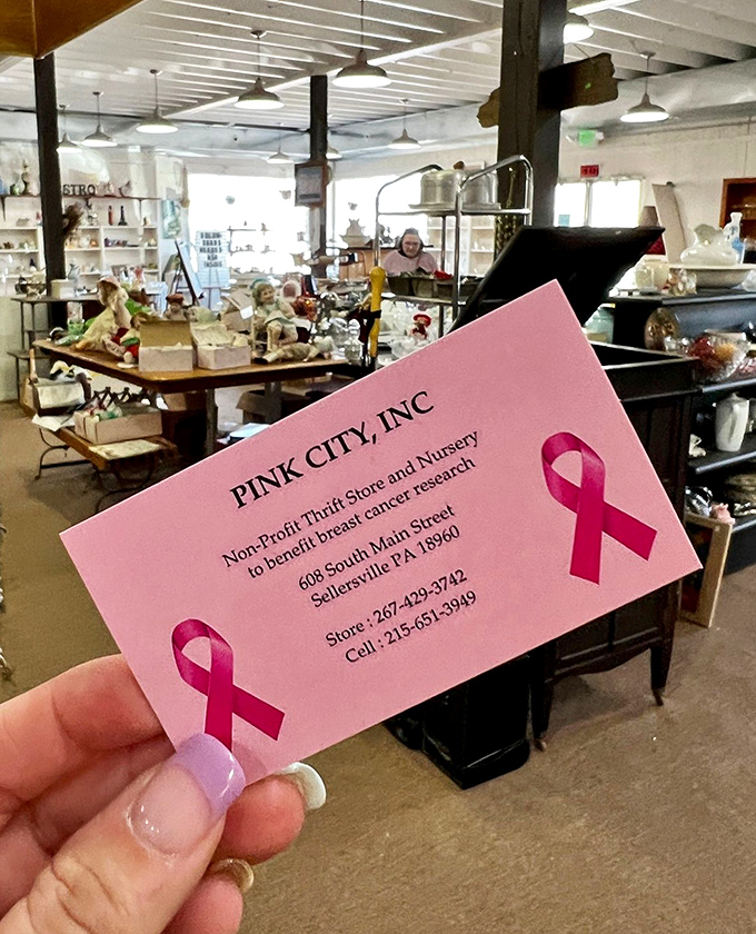 That pink business card isn't just contact information—it's your passport to secondhand paradise and charitable shopping bliss.