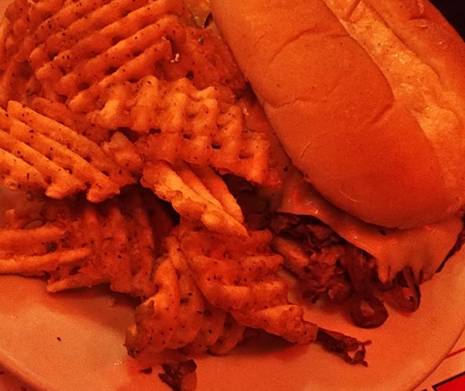 Those waffle fries aren't just a side dish—they're a supporting actor deserving of their own standing ovation alongside that magnificent sandwich.
