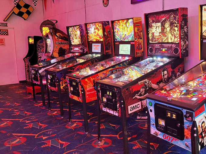 The neon glow of pinball paradise – where quarters disappear faster than your resolution to "just play one game."