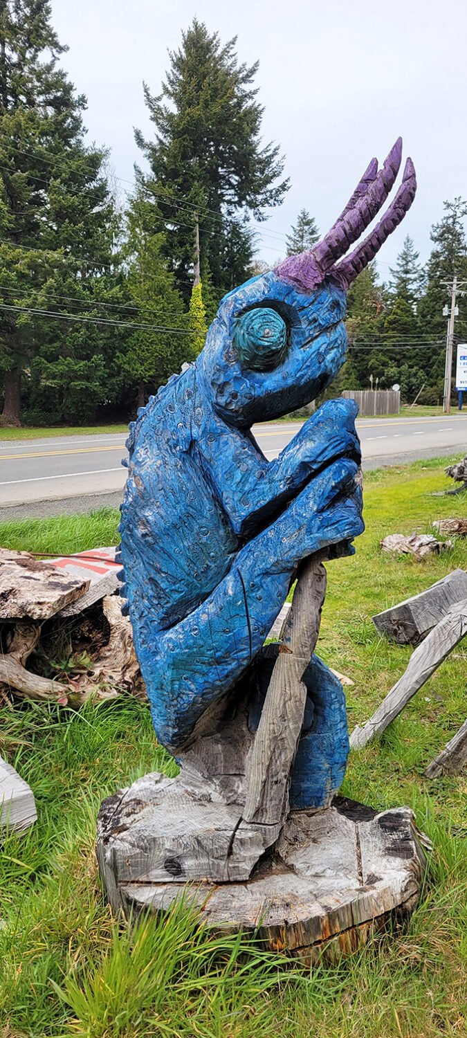 This blue creature with purple horns seems to be contemplating the meaning of life—or possibly just judging your outfit choices.
