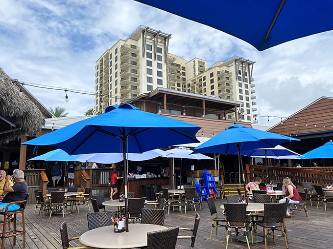 Beachfront dining with blue umbrellas as far as the eye can see – where the only thing better than the view is knowing you don't need reservations for sunset.
