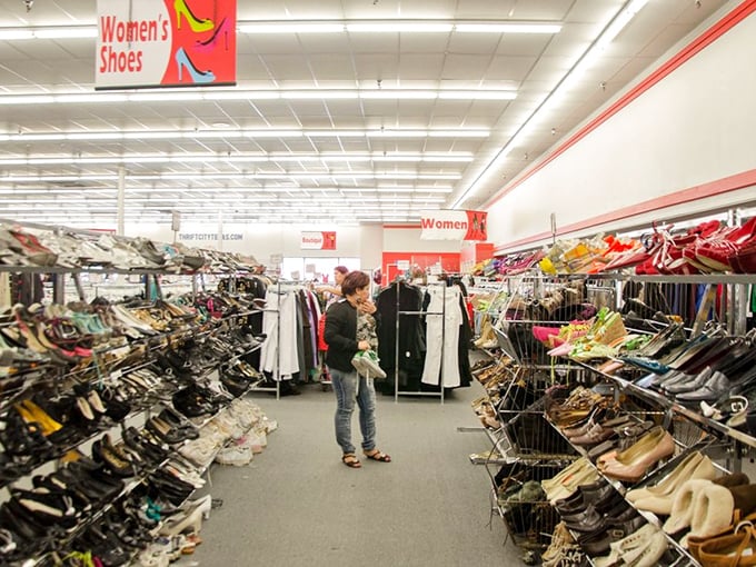 Mountains of shoes await, each pair with its own story and surprisingly intact soles.
