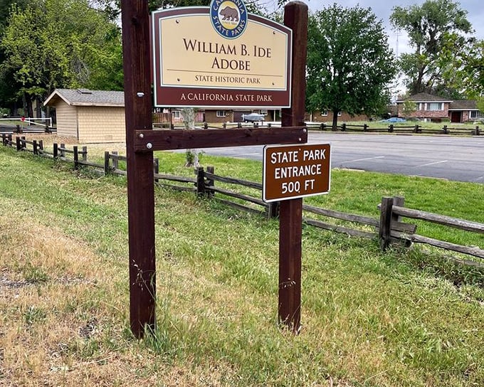 The unassuming entrance sign belies the historical significance within—like finding the Declaration of Independence at a yard sale.