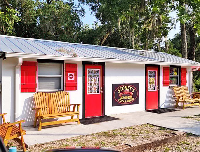 Stoney's bright red shutters practically scream "come in!" – proof that in Steinhatchee, even pizza joints embrace the coastal cottage aesthetic.