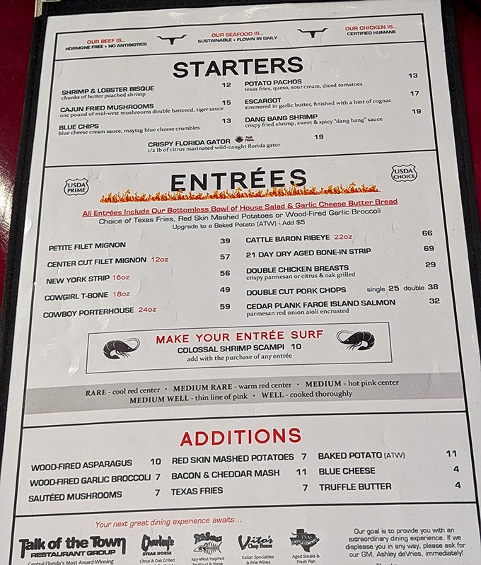 The menu doesn't mince words—it minces nothing. From Cattle Baron Ribeye to Crispy Florida Gator, this is food with character and conviction.