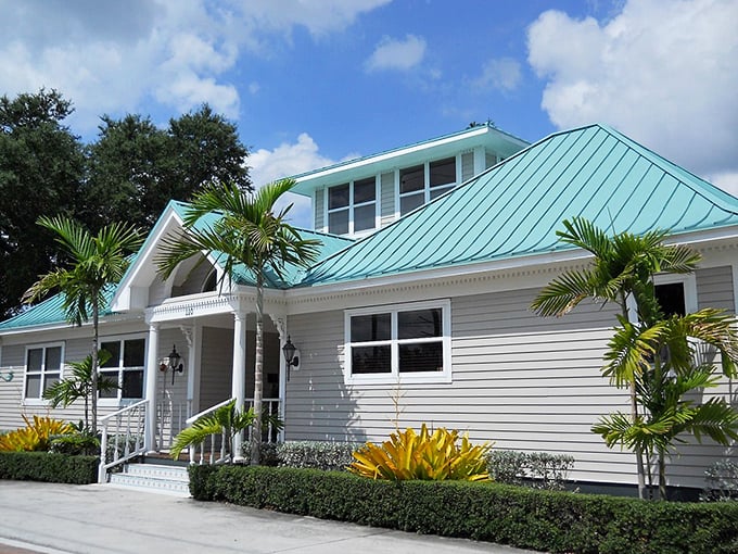 This classic Florida home with its aqua metal roof and pristine landscaping embodies Stuart's architectural character—coastal charm without the McMansion excess.