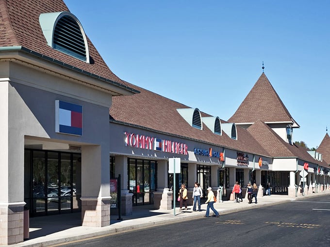 Tommy Hilfiger's storefront beckons with classic American style. Those red sale signs are the retail equivalent of a siren song.