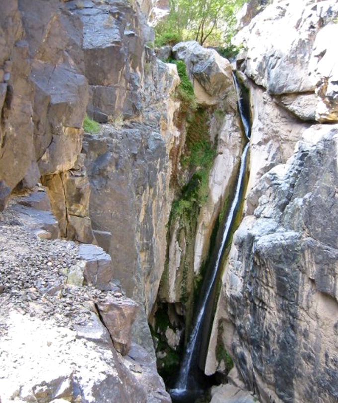 Water slicing through ancient rock like a hot knife through butter—except this took millions of years and nobody's waiting for toast.