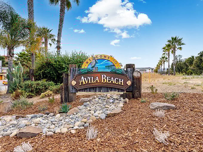 The welcome sign says Avila Beach, but it might as well read "Stress-Free Zone Ahead" – palm trees included at no extra charge.