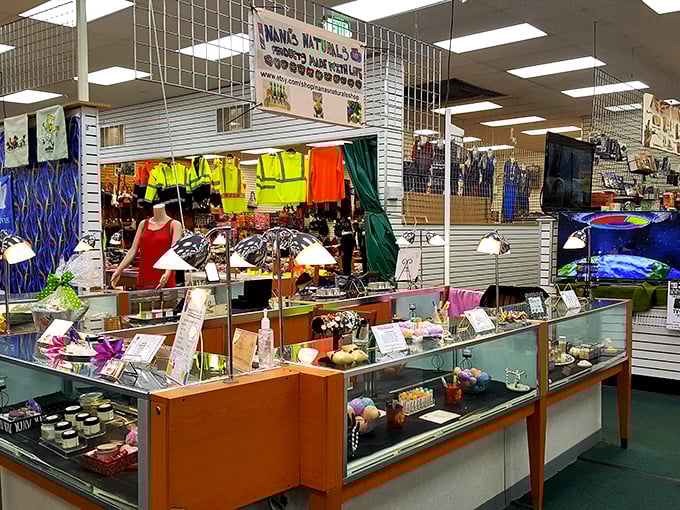 Vendor stalls create a kaleidoscope of color and merchandise – each glass case a miniature museum of potential purchases.