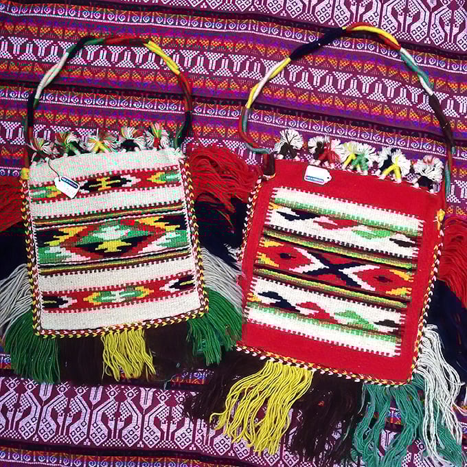 These handwoven bags aren't just accessories—they're portable art pieces with tassels that dance when you walk. Fringe benefits, indeed!
