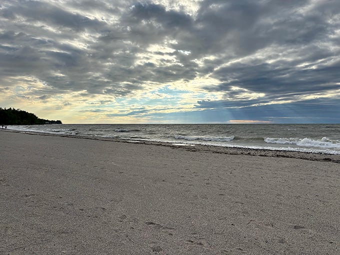 Moody skies transform Geneva's beach into a dramatic landscape painting. Even on cloudy days, this shoreline captivates with its raw beauty.