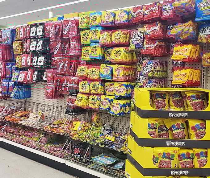 The candy aisle: where childhood nostalgia meets adult grocery budgets in a rainbow explosion of sweet temptations.