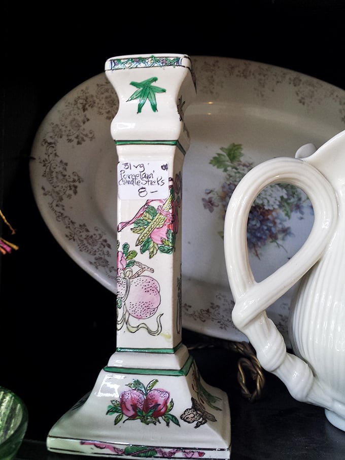 This delicate porcelain candlestick tells stories of elegant dinner parties past, its hand-painted flowers whispering secrets across centuries.