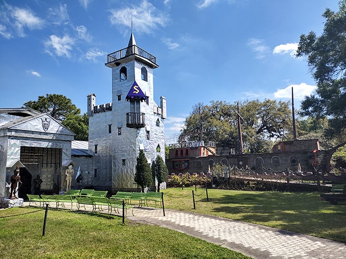 The castle's tower stands sentinel over the grounds, a beacon of creativity that says, "Yes, you really did just find a medieval fortress in rural Florida."