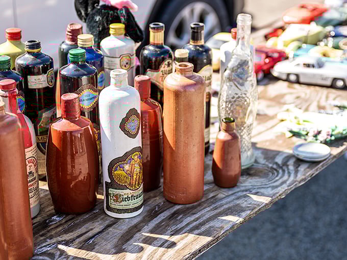Antique bottles in amber and cobalt blue, each one a tiny time capsule from Pennsylvania's past.