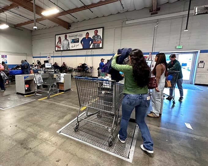 The checkout area: where pounds of possibility translate to mere dollars at the register, and shopping carts overflow with newfound treasures.
