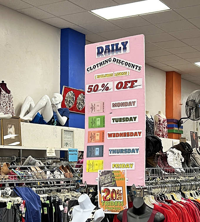 The color-coded discount board is the thrift store equivalent of a stock market ticker—strategic shoppers plan their visits around these daily deals.