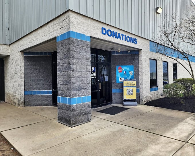 One person's decluttering is another's discovery – the donations entrance where yesterday's belongings begin their journey to new homes.