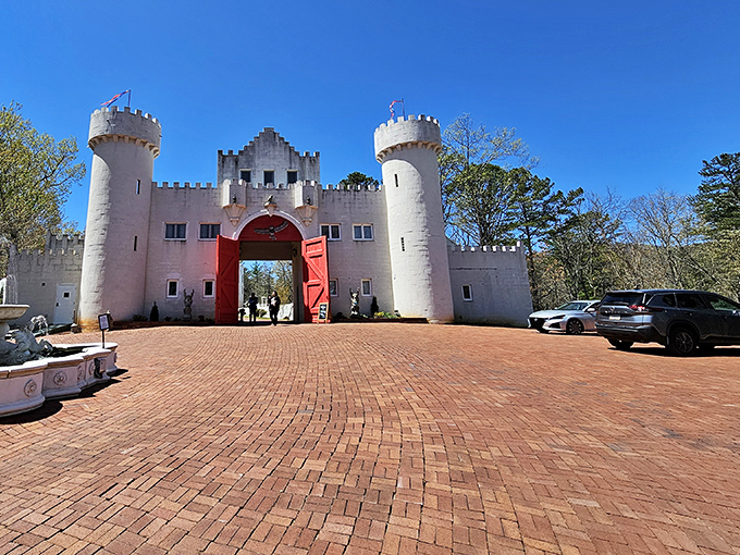 Those massive red doors aren't just for show—they're practically begging you to announce yourself with a hearty "Hark, who goes there?"