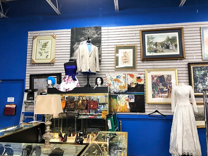 The formal wear section: where wedding dresses and blazers get their second chance at romance, all against that signature blue wall.