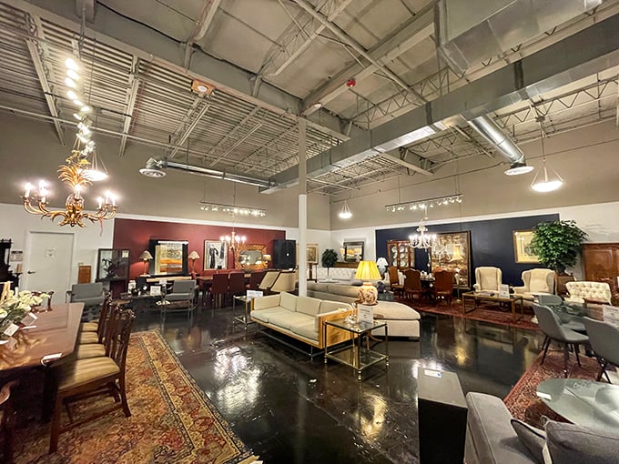 Industrial ceilings meet refined furnishings in this sprawling showroom. The polished concrete floors reflect chandeliers that have likely witnessed more interesting dinner conversations than most of us.